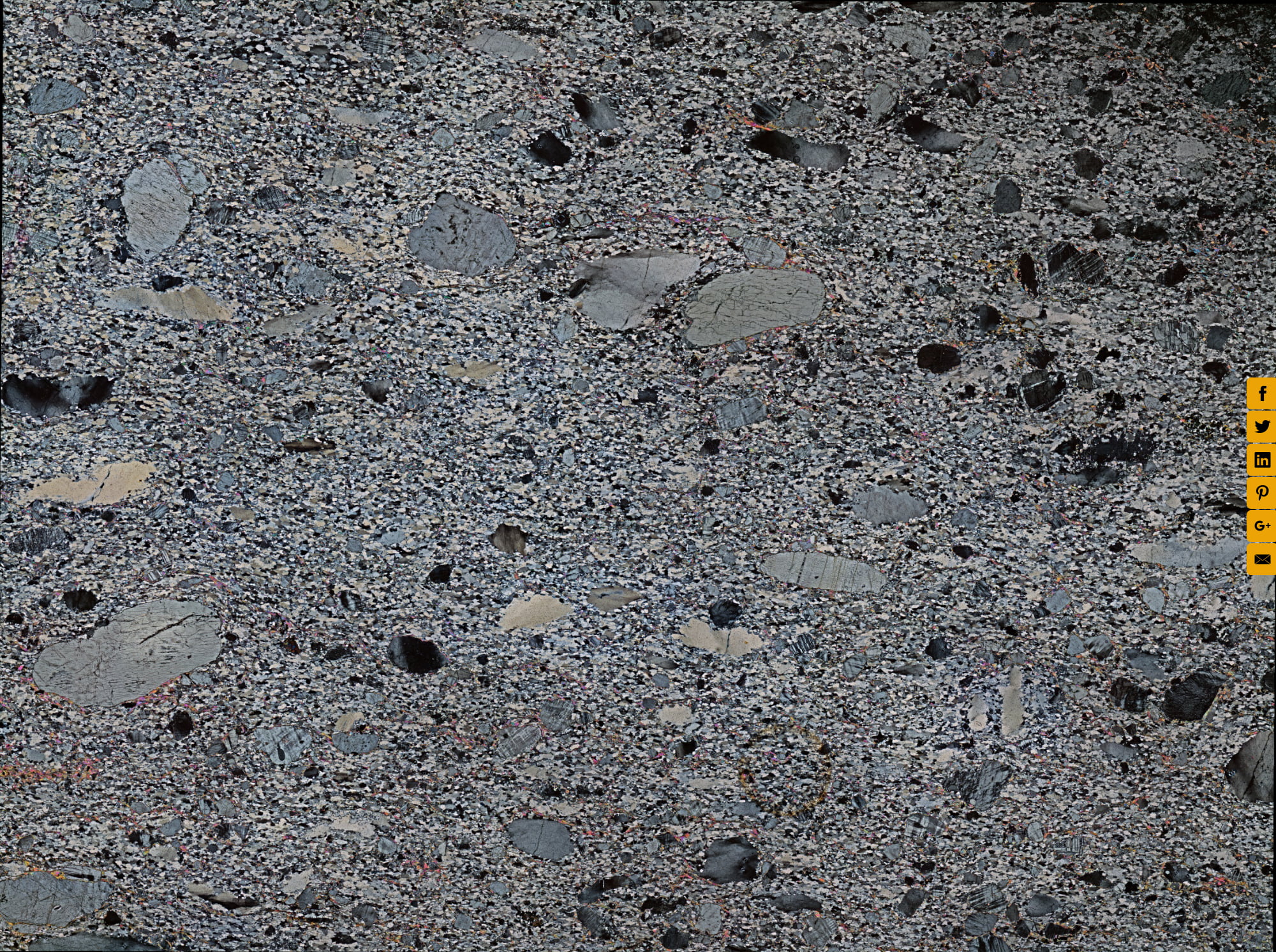 Thin Section of Deformed Quartzite with Small Pebbles